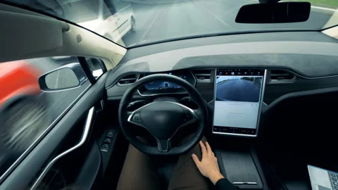 Person controls a self-driving car. Auto... | Stock Video | Pond5