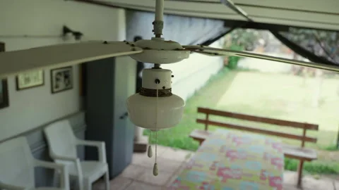 Person hand turning on ceiling fan pulli... | Stock Video | Pond5