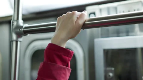 Person holding on to hand rail of subway... | Stock Video | Pond5