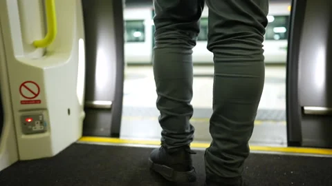 Person legs leaving subway train on plat... | Stock Video | Pond5
