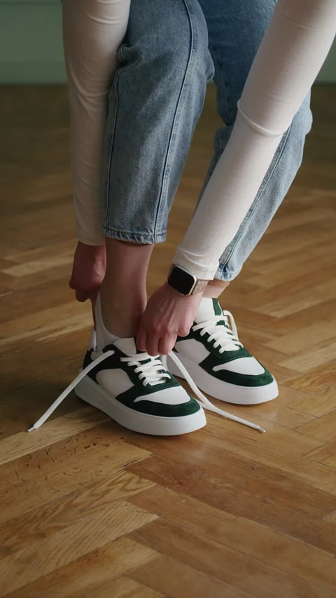 Person with one foot raised wearing whit... | Stock Video | Pond5