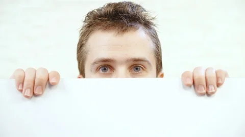 Person peek over a wall left and right i... | Stock Video | Pond5