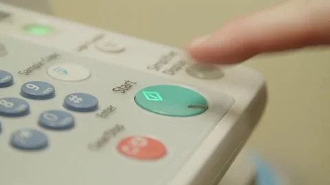 Person pushing start button on printer | Stock Video | Pond5