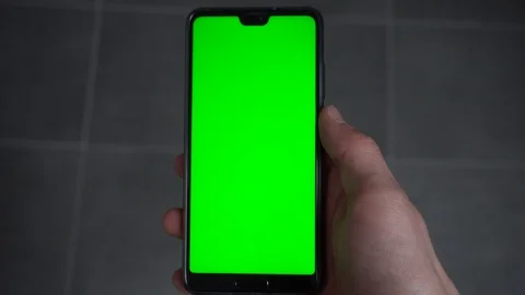 A person scrolling on a phone with a gre... | Stock Video | Pond5