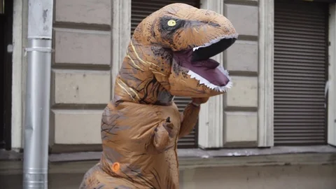 Person in t rex mascot costume spinning ... | Stock Video | Pond5