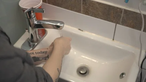 A Person With Tattoos Washing Her Hands ... | Stock Video | Pond5