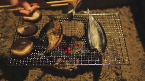 Person Turning Fish On Other Side Using ... | Stock Video | Pond5