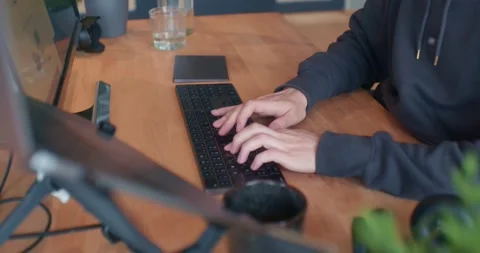 Person typing on the computer inside the... | Stock Video | Pond5