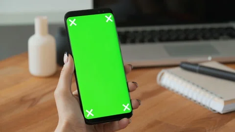 Person using cell phone with green scree... | Stock Video | Pond5