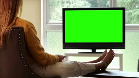 A Person watching TV with green screen i... | Stock Video | Pond5