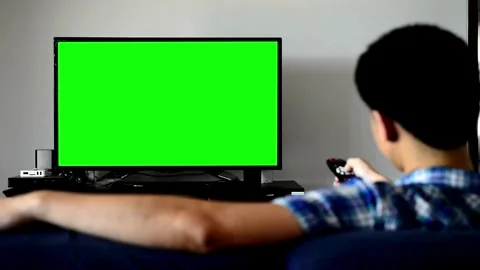 A Person watching TV with green screen i... | Stock Video | Pond5