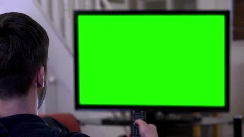 A Person watching TV with green screen i... | Stock Video | Pond5