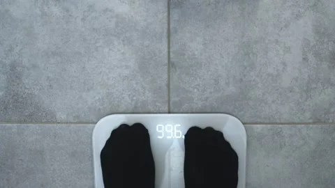 A person wearing black socks stands on a... | Stock Video | Pond5