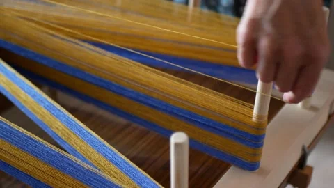 Person is winding a warp for the weaving... | Stock Video | Pond5
