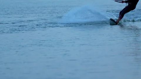 A person's foot, wearing a shoe, is skim... | Stock Video | Pond5