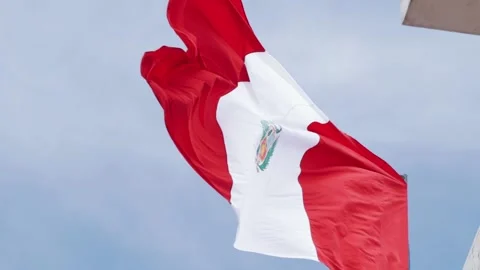 Peruvian flag flying with blue sky in th... | Stock Video | Pond5