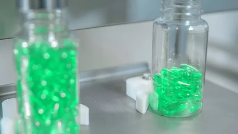 A pharmaceutical lab machine filling bot... | Stock Video | Pond5