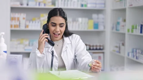 Pharmacist woman make phone call to clie... | Stock Video | Pond5