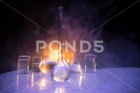 Pharmacy and chemistry theme. Test glass flask with solution in ...