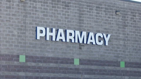 Pharmacy sign on exterior wall of retail... | Stock Video | Pond5