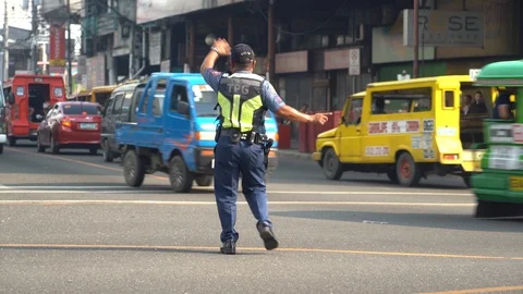 Philippine Policeman dancing whilst dire... | Stock Video | Pond5