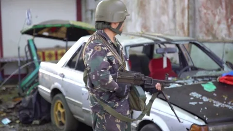 Philippine soldier holding huge machine ... | Stock Video | Pond5