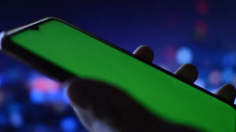 phone green screen in a blurred city bac... | Stock Video | Pond5