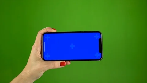 Phone screen is blue chroma key. Green s... | Stock Video | Pond5