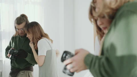 Photographer and Model Reviewing Images ... | Stock Video | Pond5