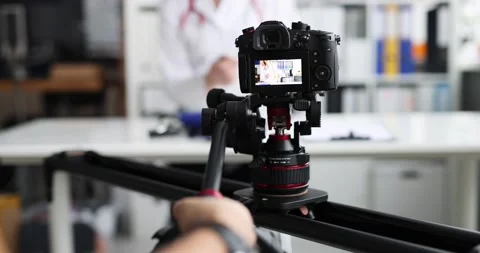 Photographer filming doctor on camera us... | Stock Video | Pond5