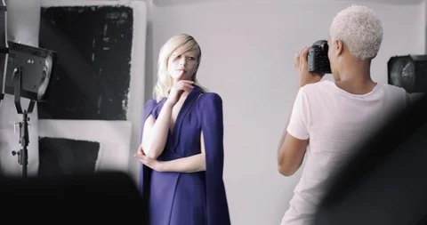 Photographer giving model direction on a... | Stock Video | Pond5