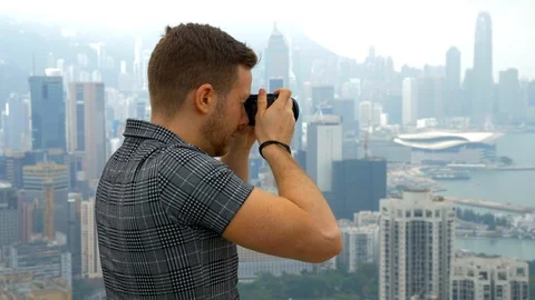 Photographer Man Capturing Hong Kong Sky... | Stock Video | Pond5