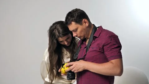 Photographer shows models captured frame... | Stock Video | Pond5