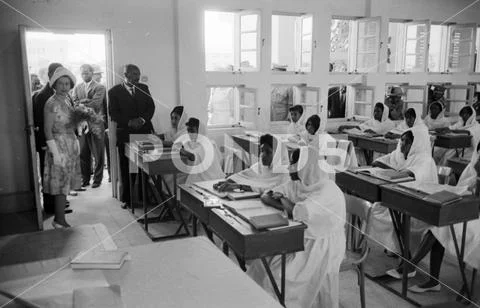 A picture of Queen Elizabeth II with President Dr. Tigani El Mahi and ...