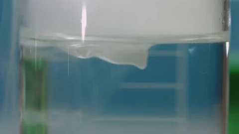 A piece of dry ice floating in water | Stock Video | Pond5