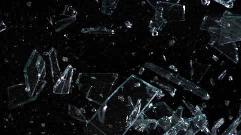 pieces of glass fly on a black backgroun... | Stock Video | Pond5