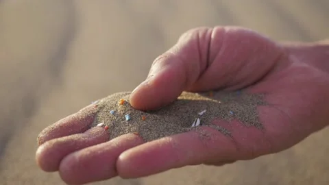 pieces of microplastic on the sand beach... | Stock Video | Pond5