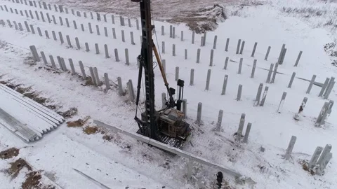 Pile bore machine lifts a reinforced con... | Stock Video | Pond5