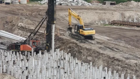 Pile driving machine drives piles to pou... | Stock Video | Pond5