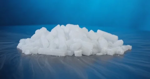 Pile of dry ice pellets spinning against... | Stock Video | Pond5