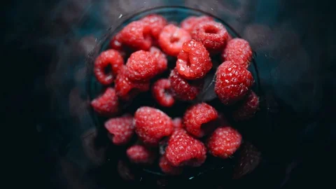 A pile of fresh raspberry berries quickl... | Stock Video | Pond5