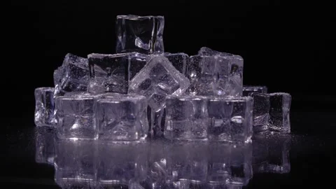 Pile of ice cubes with a purple tint rot... | Stock Video | Pond5