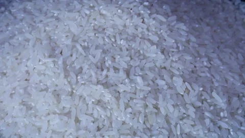 a pile of rice-camera panning on black b... | Stock Video | Pond5