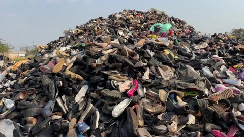Pile shoes trash landfill outdoor for re... | Stock Video | Pond5