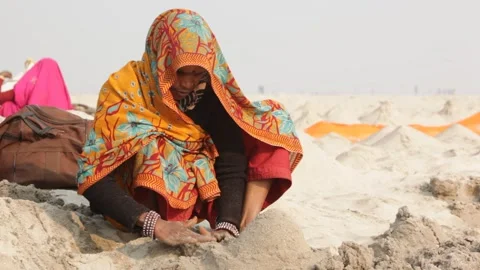Pilgrims digging hair in the sand, Maha ... | Stock Video | Pond5
