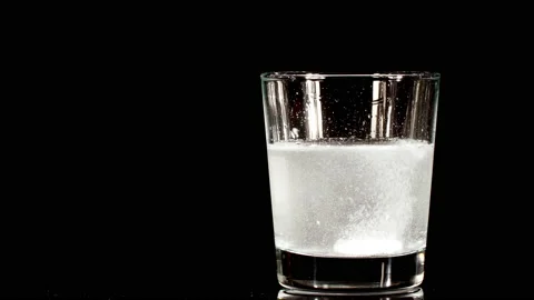 Pill aspirin falling down in glass with ... | Stock Video | Pond5
