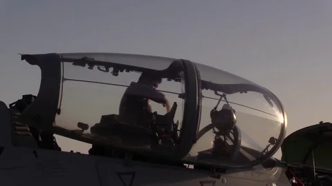 Pilot climbing out of cockpit of Afghan ... | Stock Video | Pond5