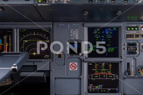 Pilot in command setting control panel in cockpit Stock Photo #236317745