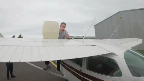 Pilot Measures Fuel Of A Cessna Plane, D... | Stock Video | Pond5