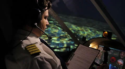 Pilot reading and filling out flight for... | Stock Video | Pond5